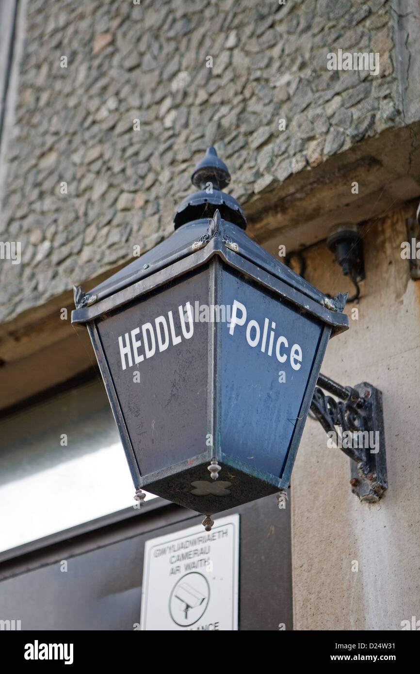 Heddlu Police old fashioned blue oil lamp sign in Holyhead Wales Stock ...