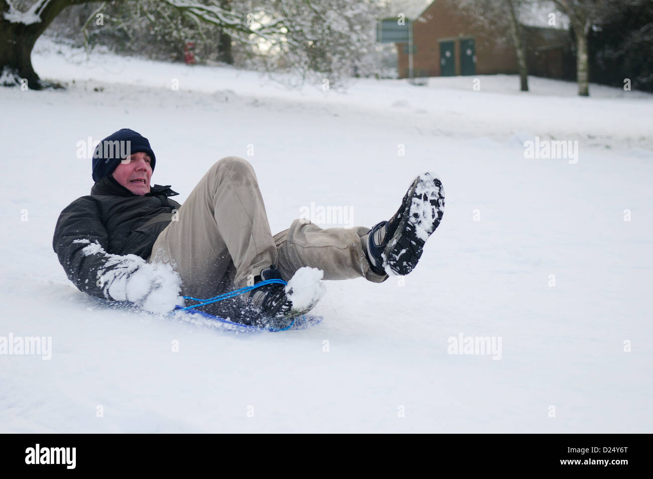 Middle Aged Man Sledges With Look Of Fear On His Face Stock Photo - Alamy
