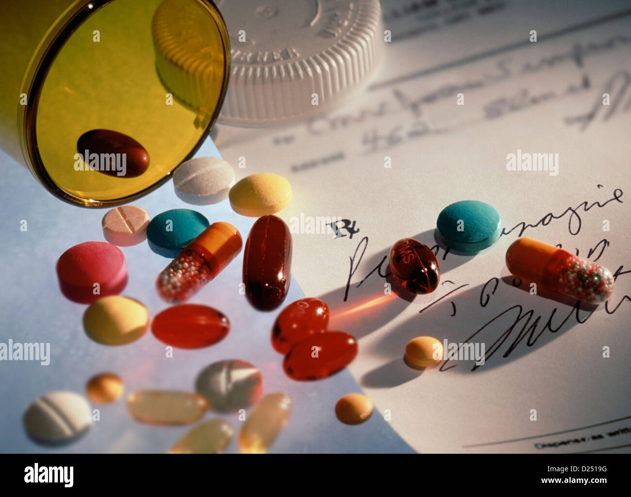 various pills (Medication) coming out of a pill bottle over a ...