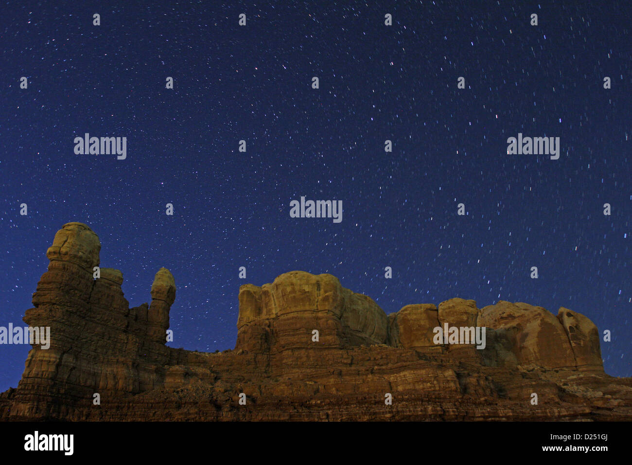Stars over eroded rock formation at night, Bluff, Utah, U.S.A., may ...