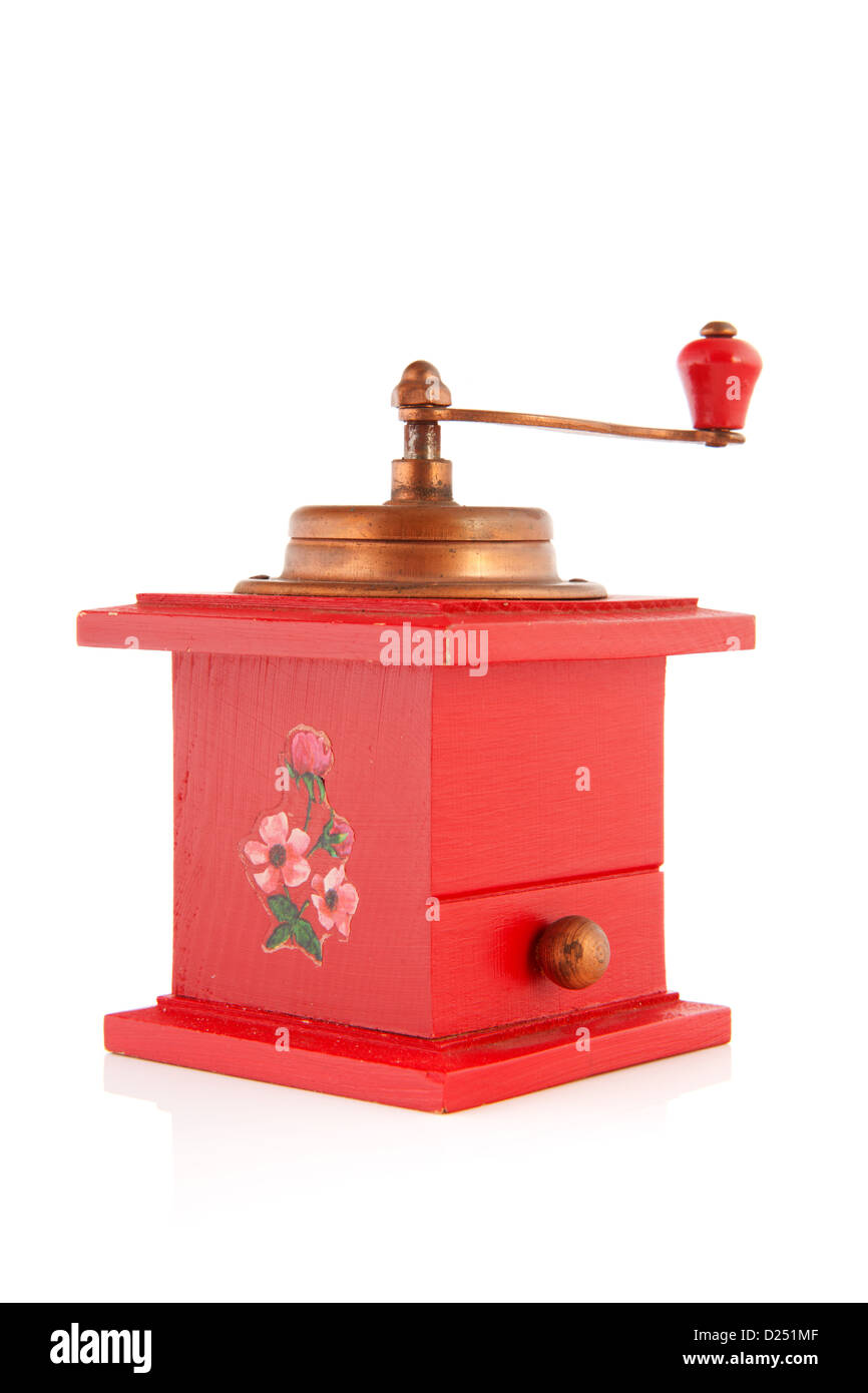 Red old coffee grinder isolated over white background Stock Photo - Alamy