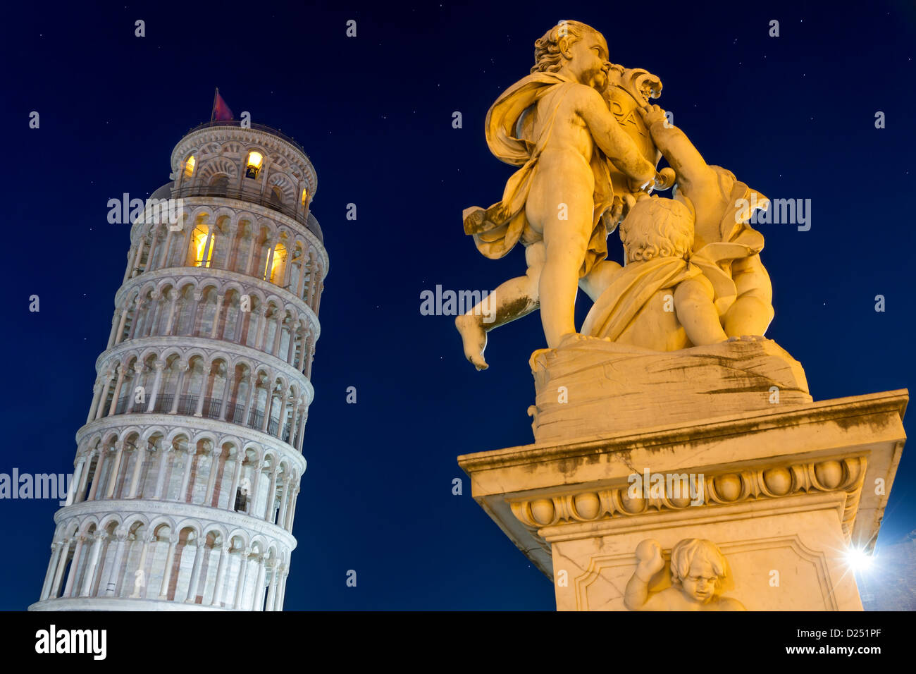 Leaning Tower of Pisa with statue after sunset, Tuscany, Italy Stock ...