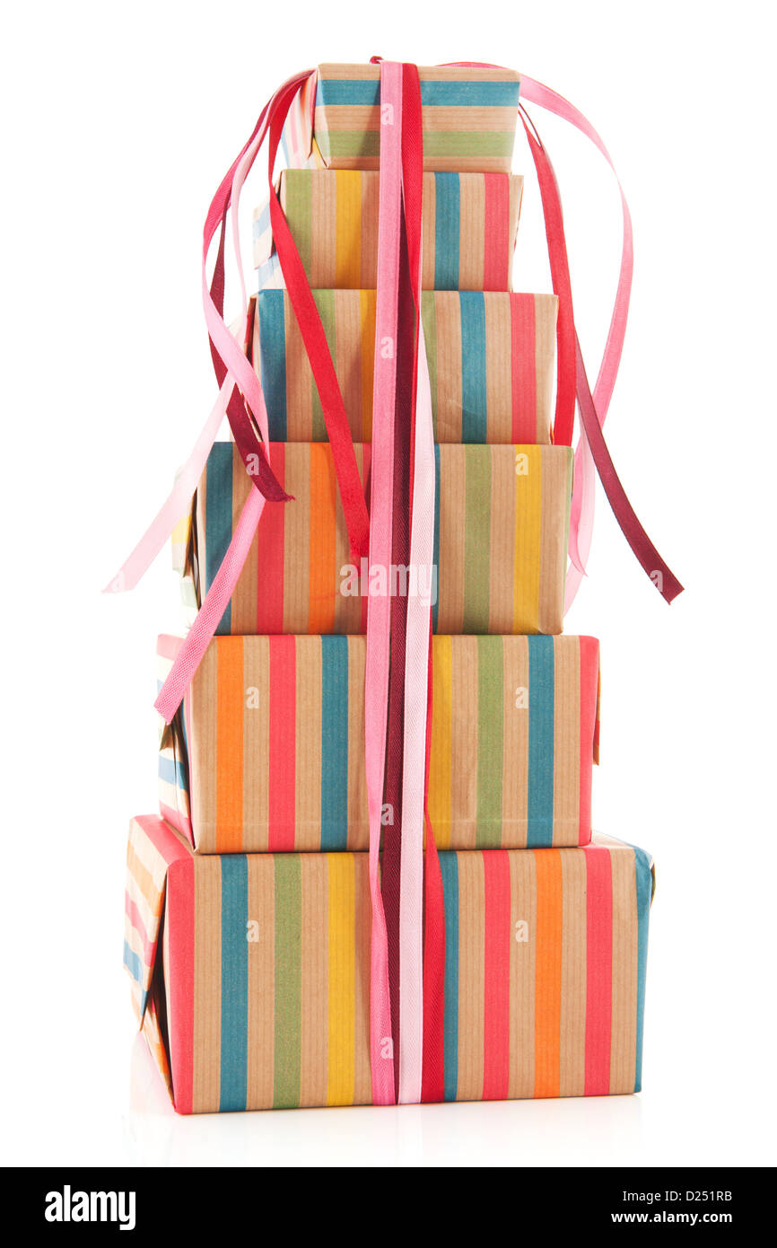 colorful stack with wrapped presents and flowers isolated on white ...