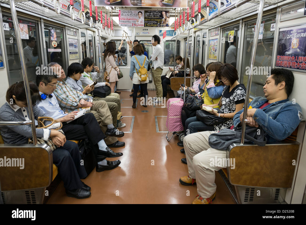 Commuters on-board a Chuo Line Subway Train in Osaka, Japan Stock Photo ...