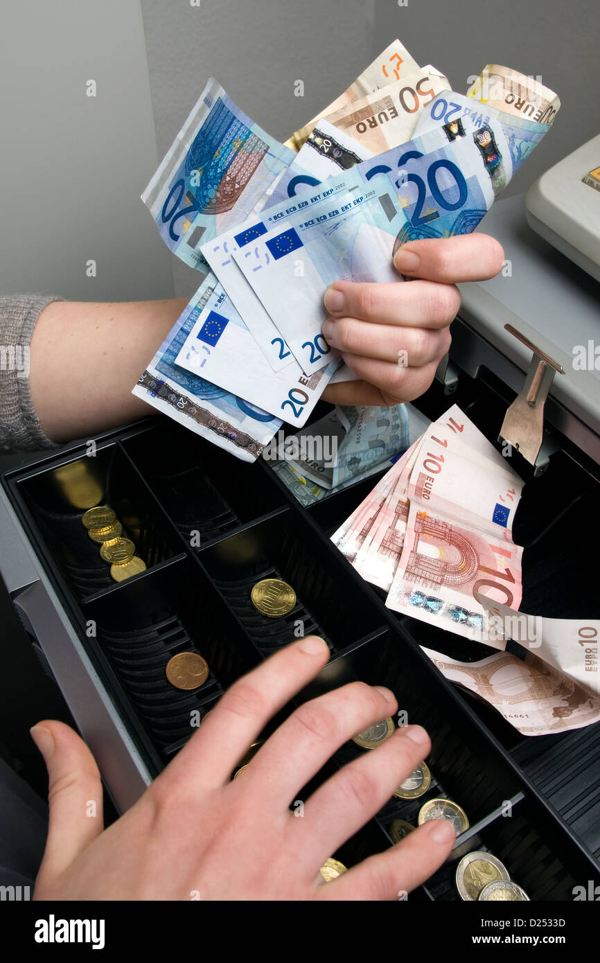 Berlin, Germany, cash is taken out of the cash register Stock Photo - Alamy