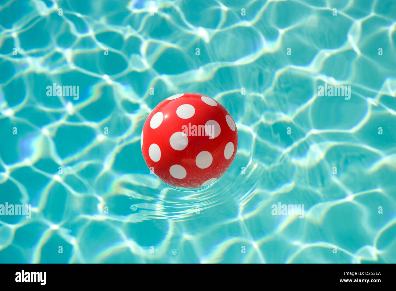 Vacqueyras, France, a red-white dotted ball in a swimming pool Stock ...