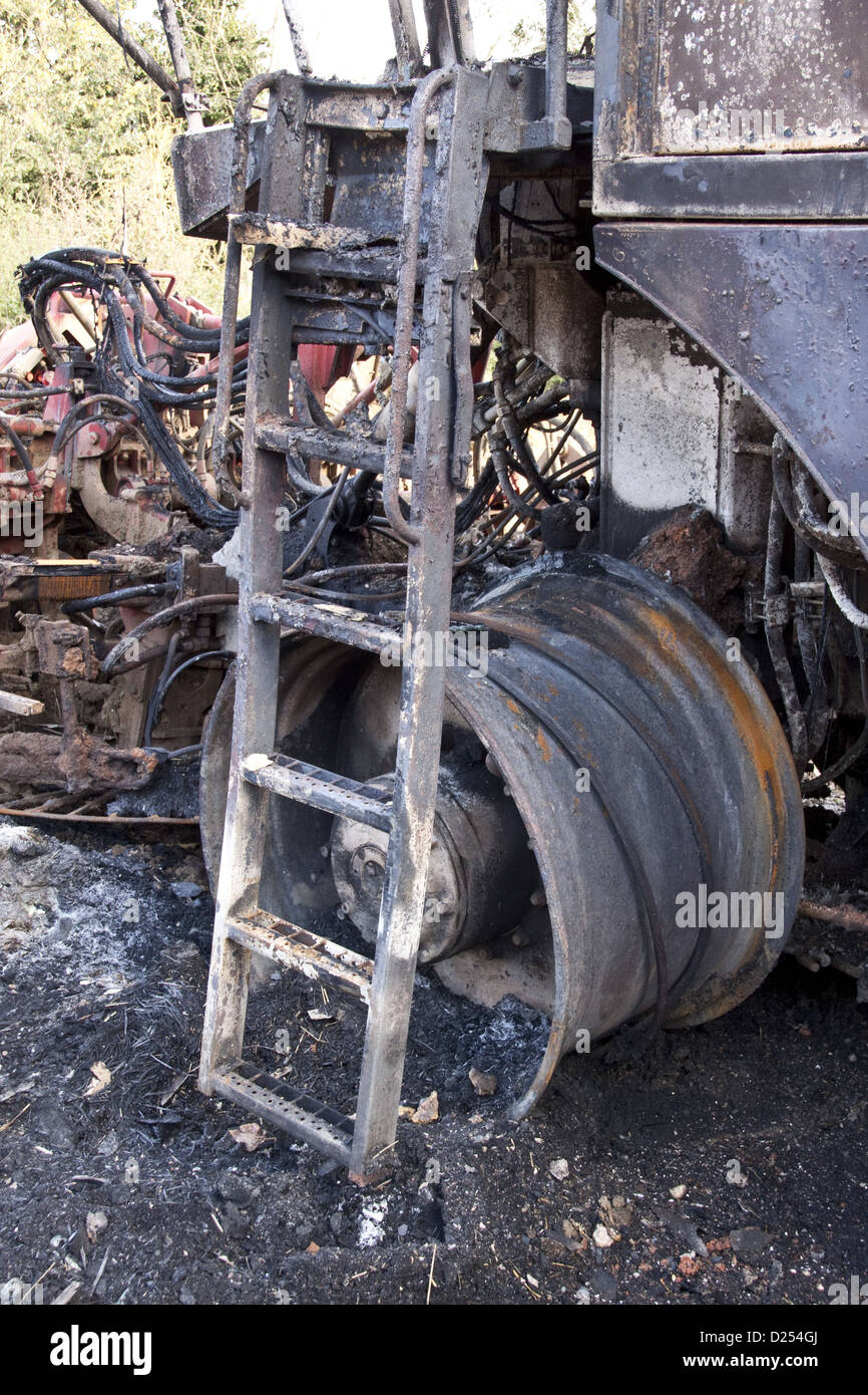 The remains of a burnt out sugar beat harvester Stock Photo - Alamy