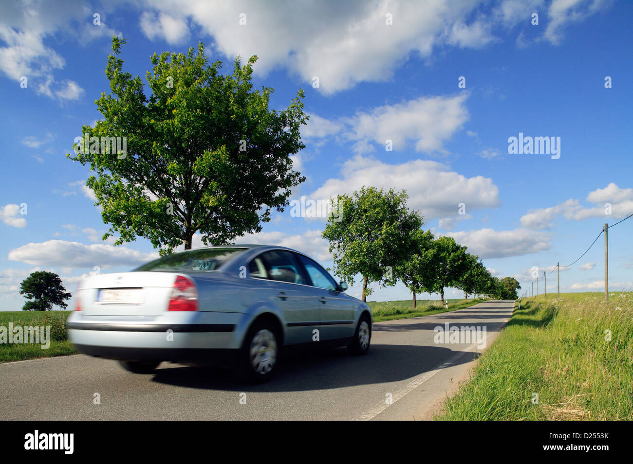 Large trowel, Germany, car on a country road Stock Photo - Alamy