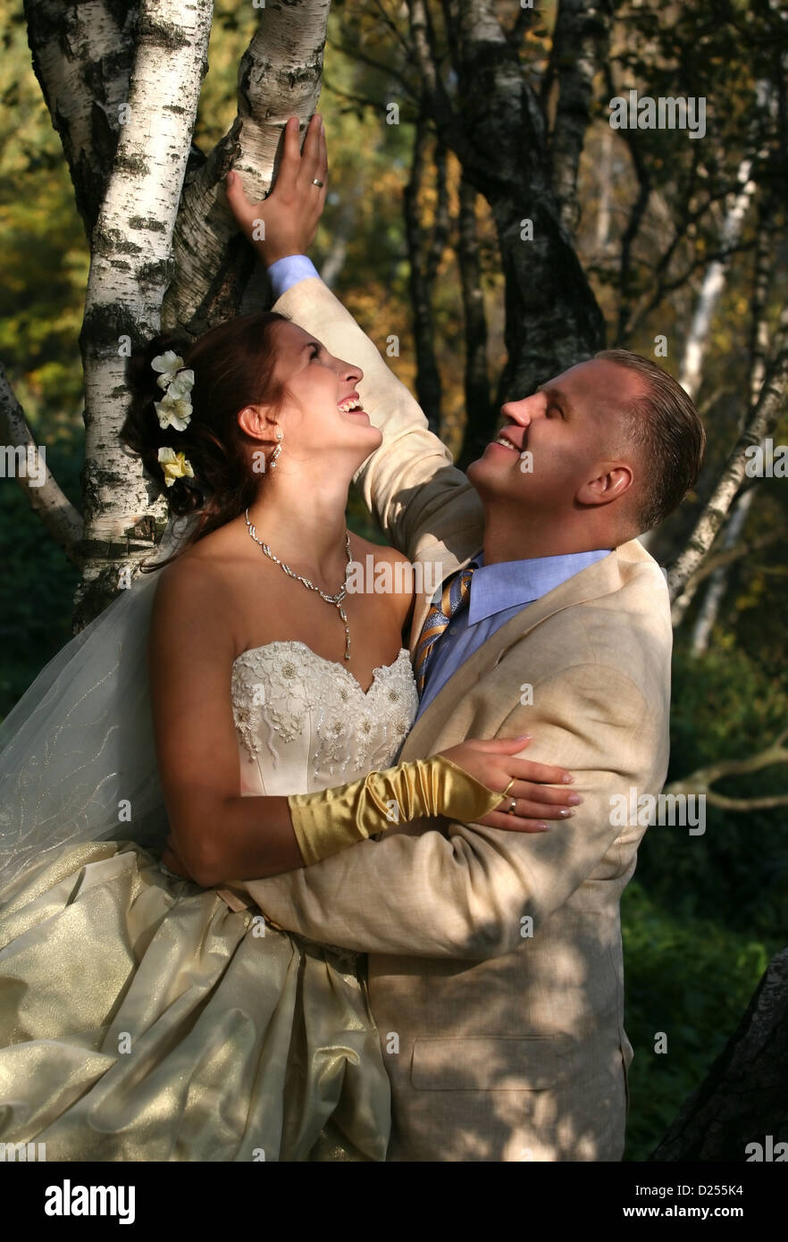 Beautiful the bride and the groom in park Stock Photo - Alamy