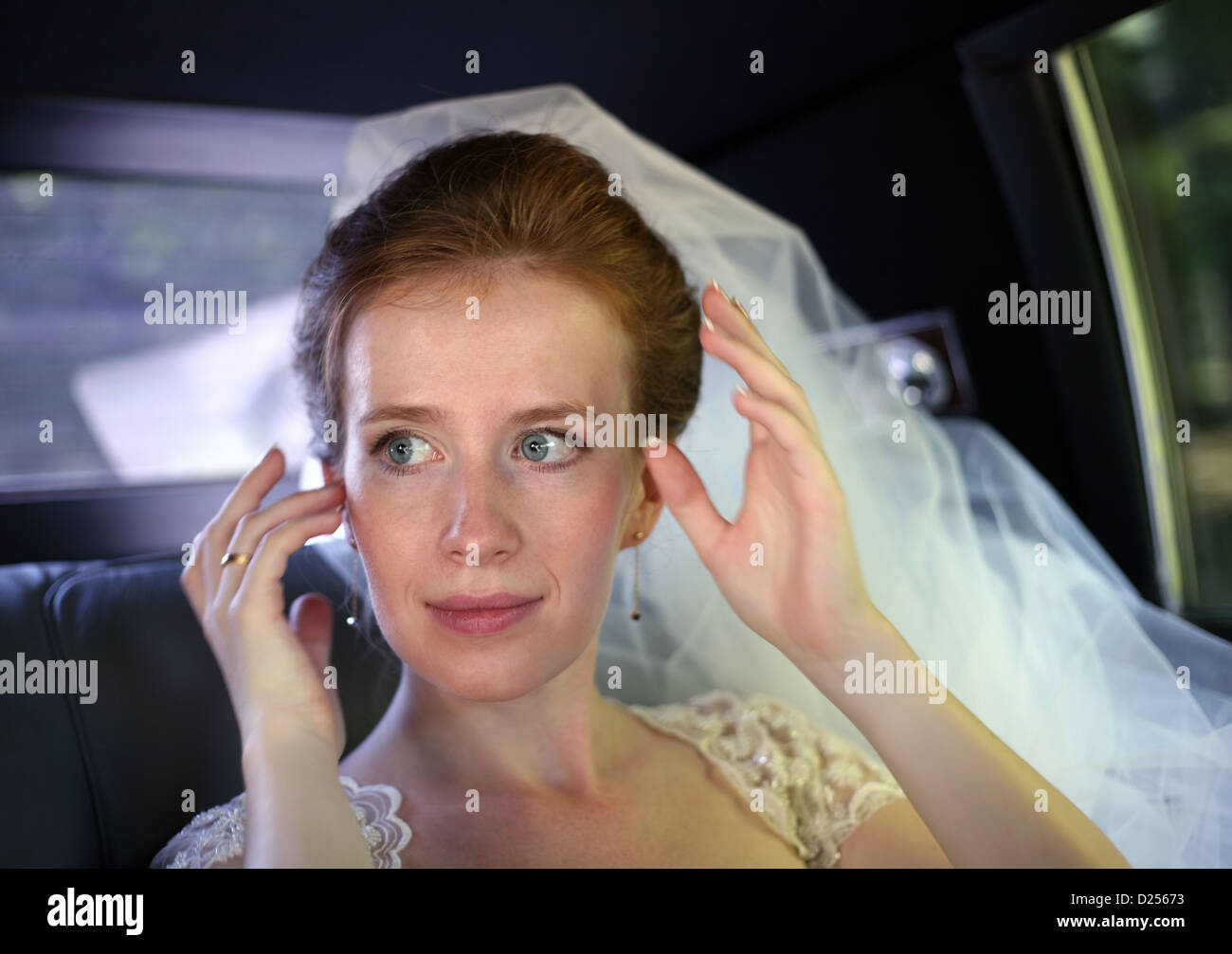 Beautiful the bride in car Stock Photo - Alamy