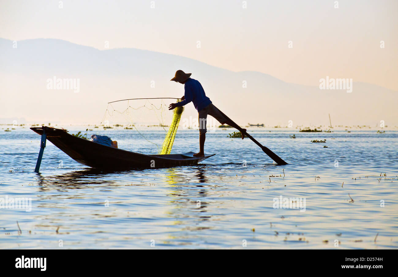 fishing while balancing with legs, inle, Myanmar, Burma Stock Photo - Alamy