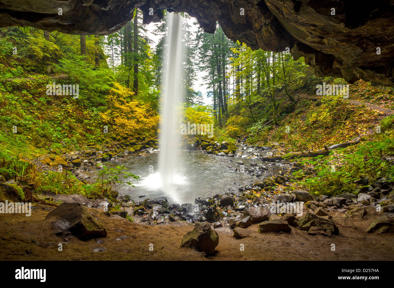 Unique view of a waterfall from behind Stock Photo - Alamy