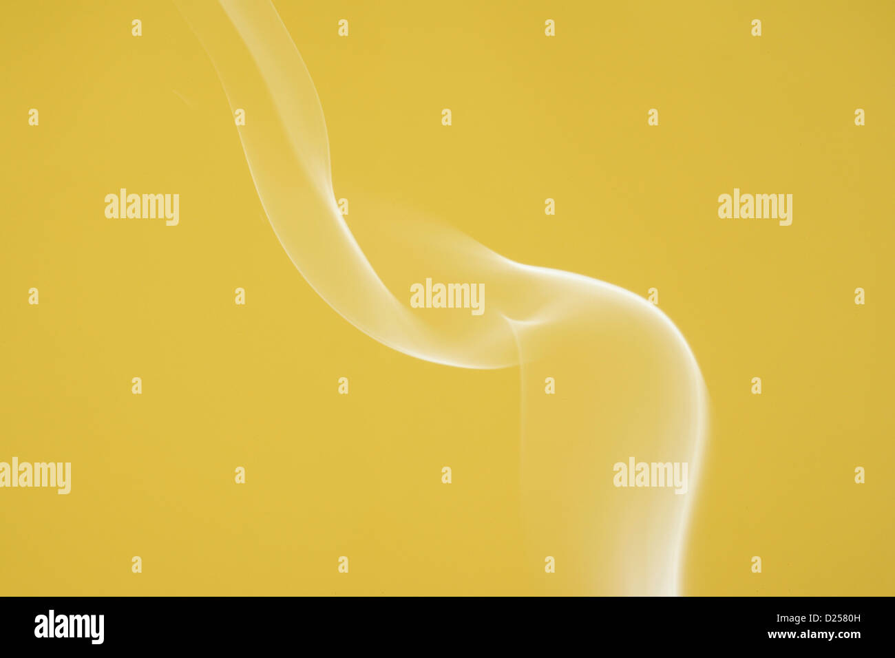 White smoke on yellow background Stock Photo - Alamy
