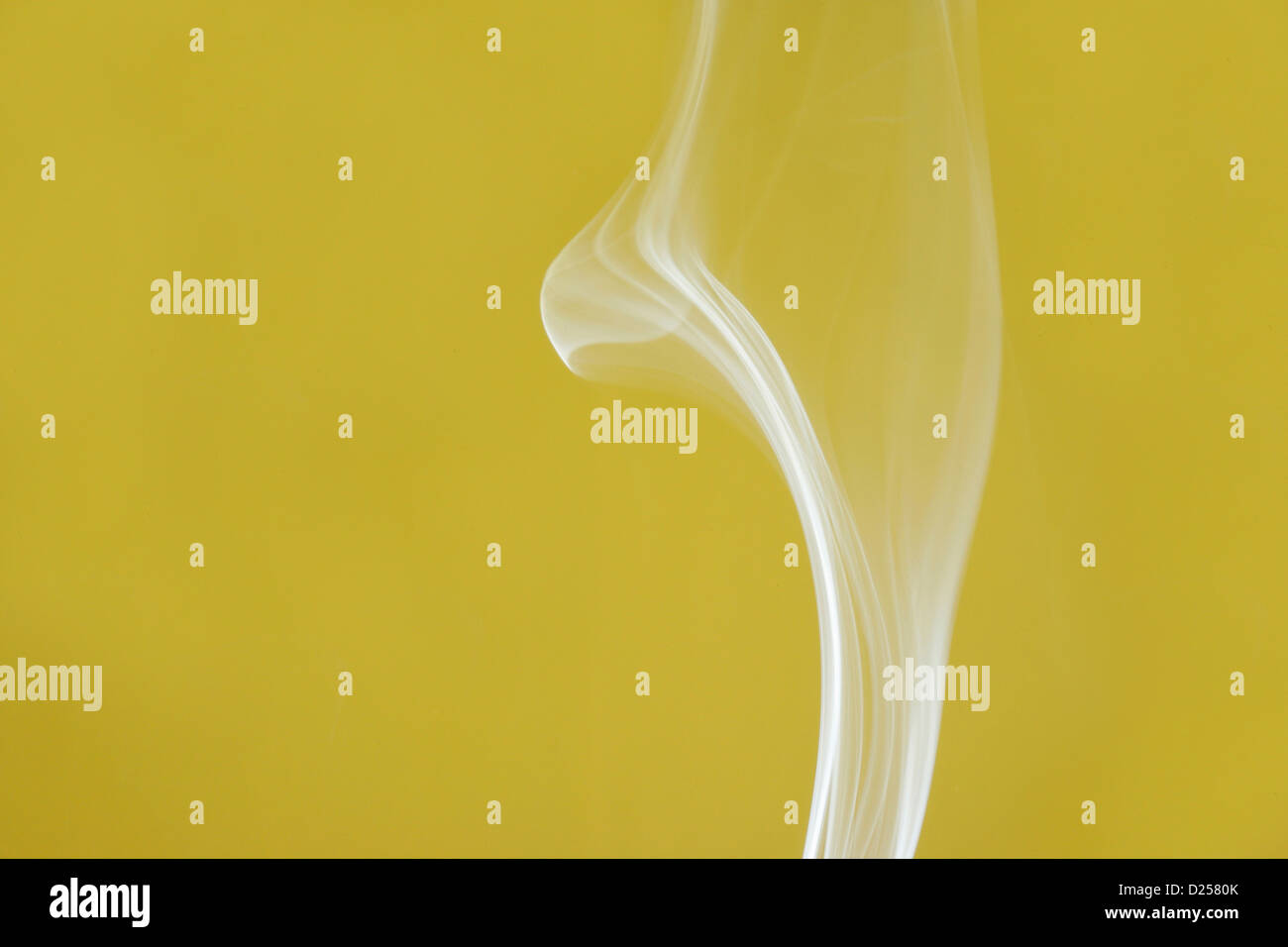 White smoke on yellow background Stock Photo - Alamy