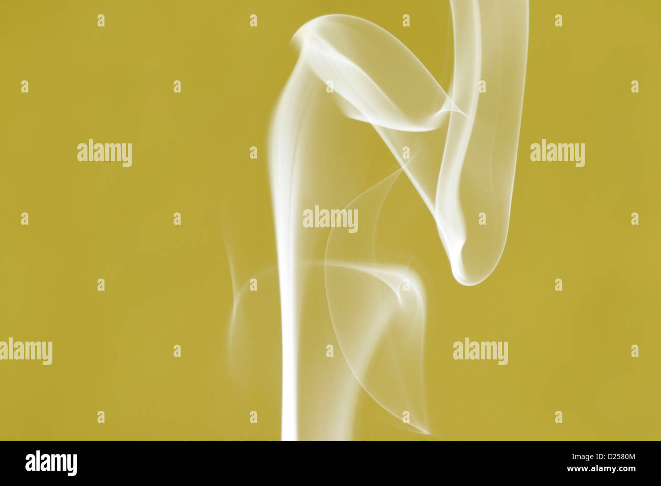 White smoke on yellow background Stock Photo - Alamy