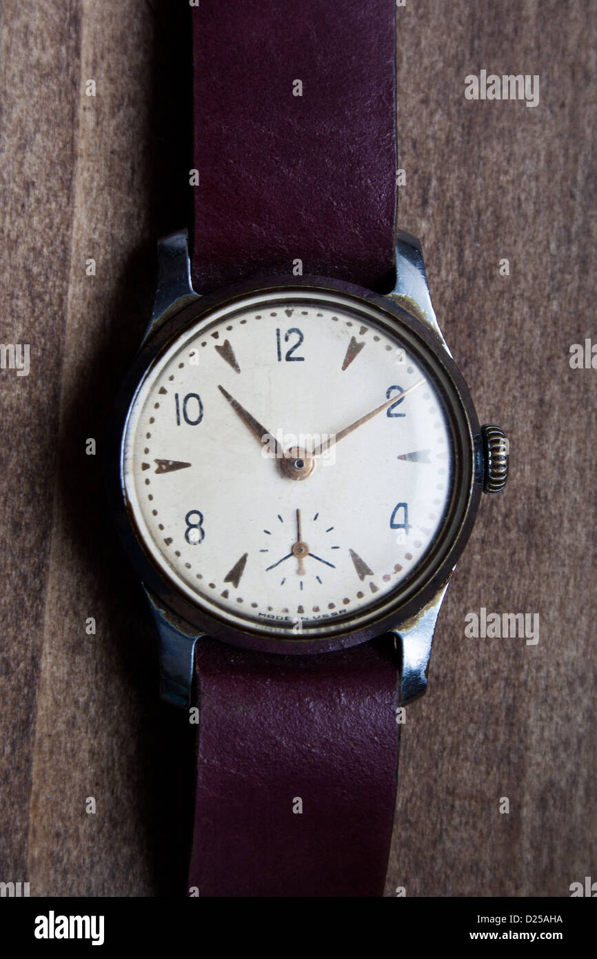 Old wrist watch on table Stock Photo - Alamy
