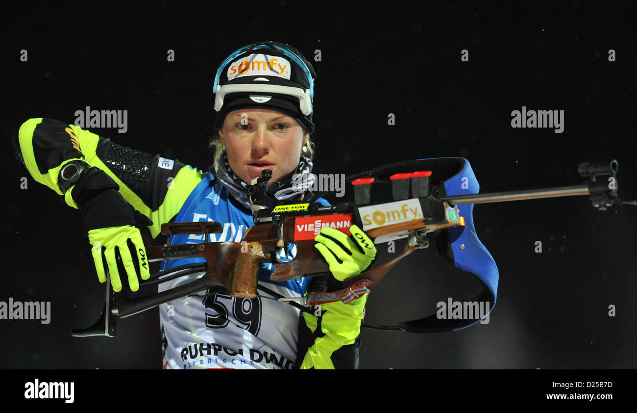 French biathlete Marie Dorin Habert stands with her rifle at the ...
