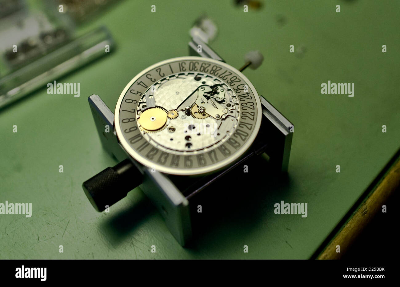 The internal clockwork of a watch is on display in the workshop of ...