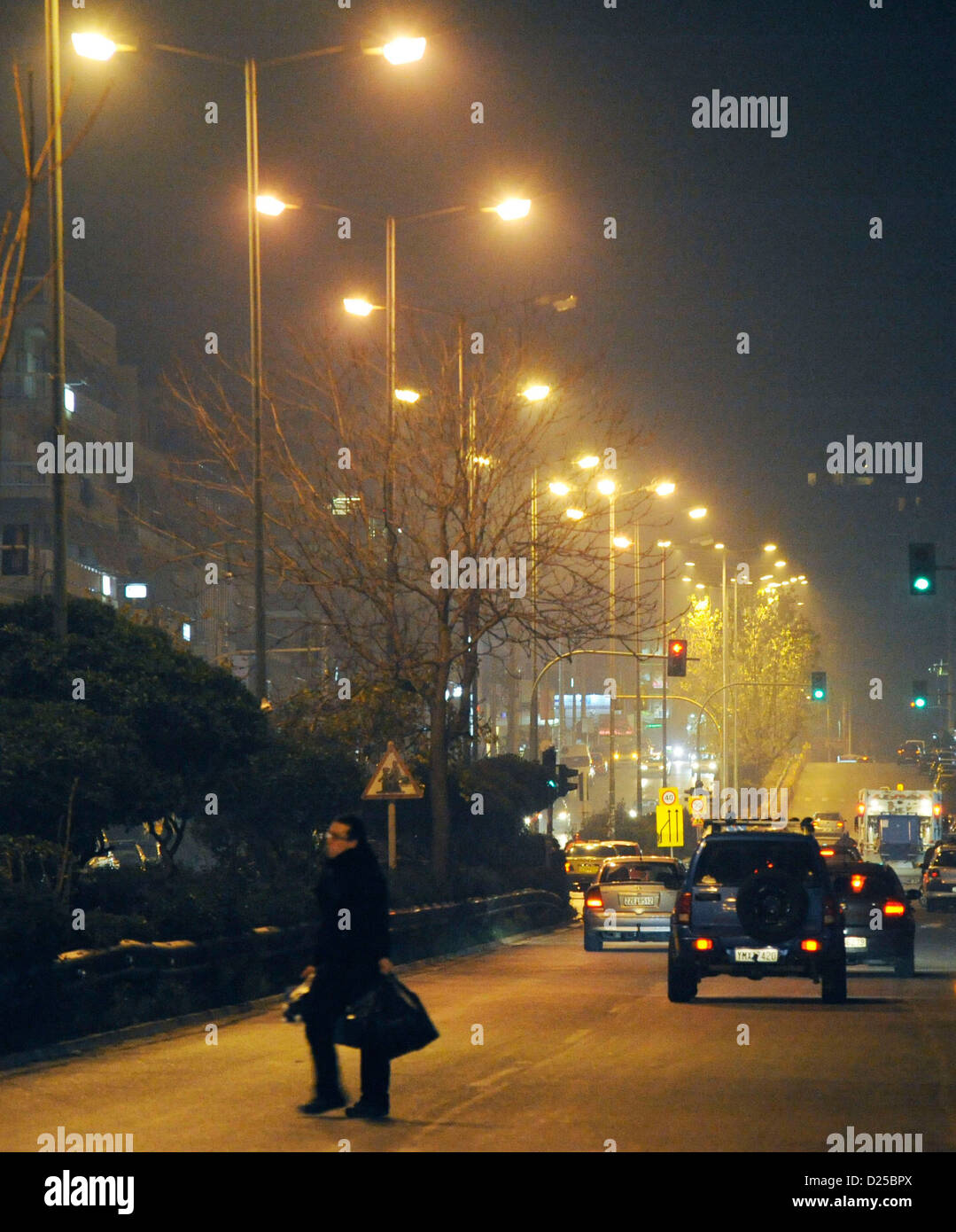 Smog hangs in the air on the streets of Athens, Greece, 12 January 2013 ...
