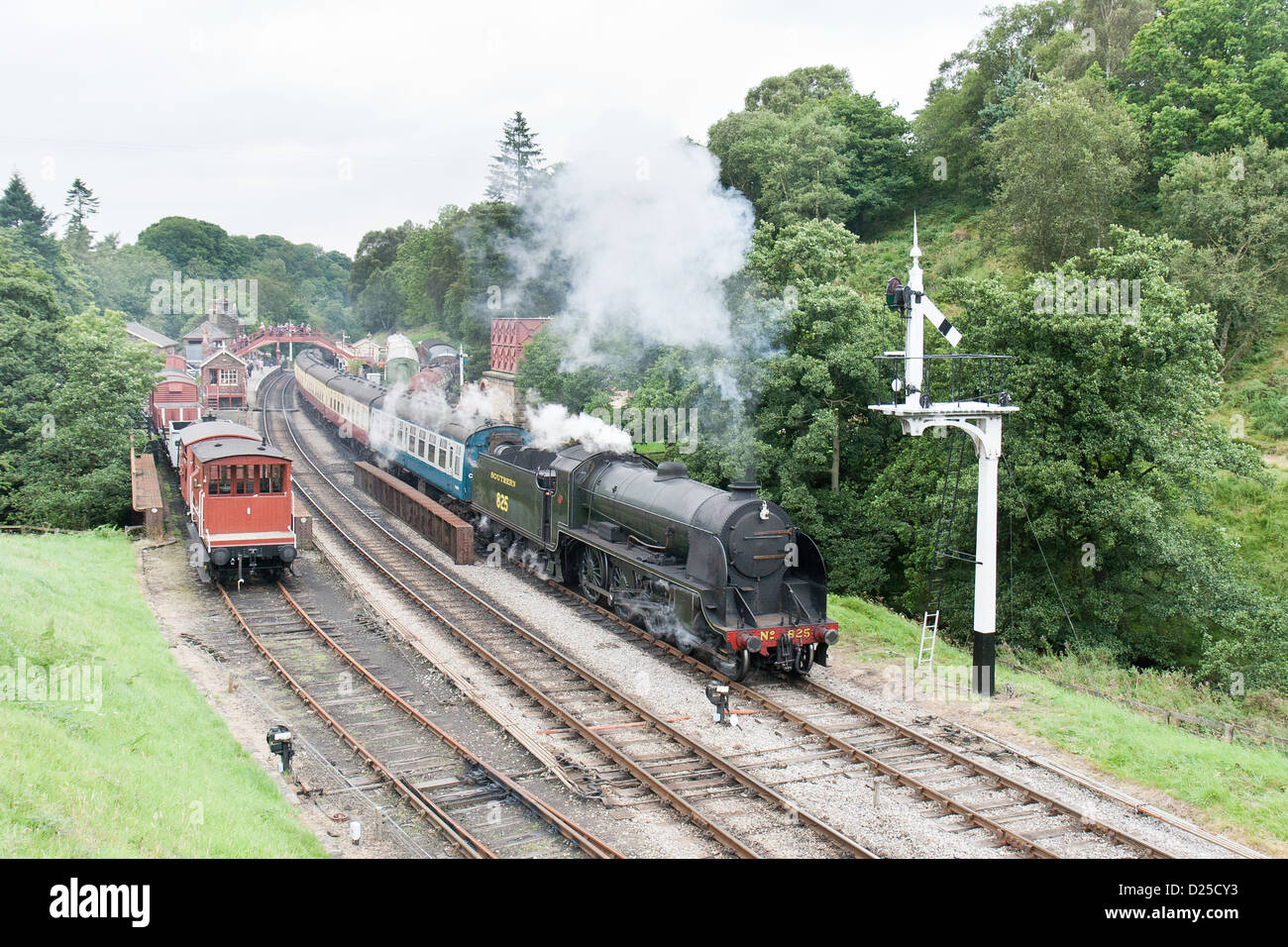Steam train pulling passenger coaches hi-res stock photography and ...