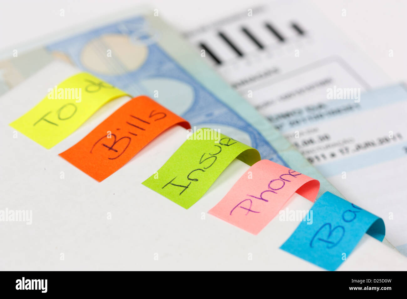 bills to pay with some post-it and banknotes inside an book Stock Photo ...