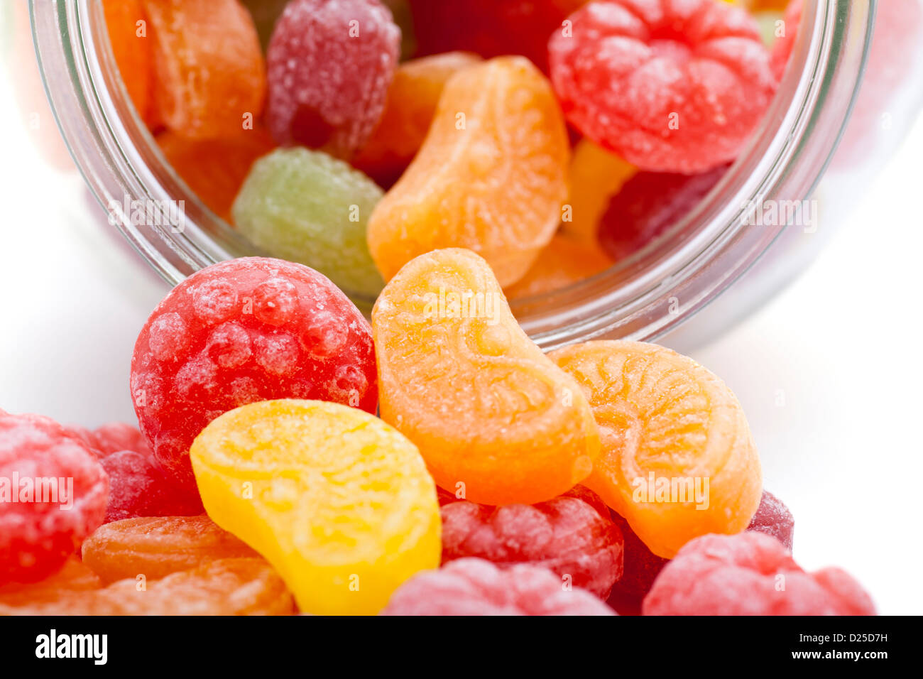 Colorful candies pouring from a jar Stock Photo - Alamy