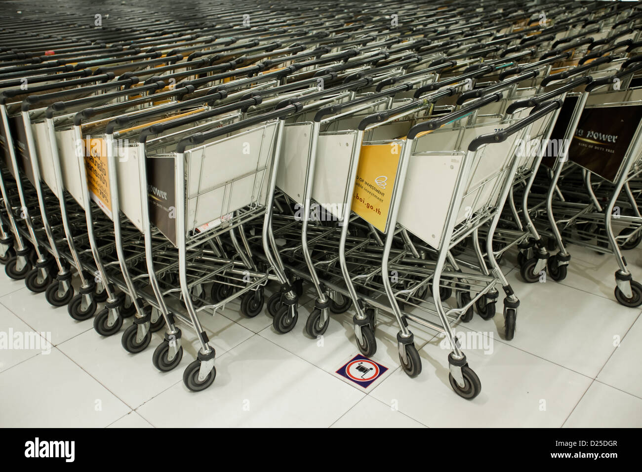 BANGKOK – JANUARY 17. Stacked empty trolleys in early morning Bangkok ...