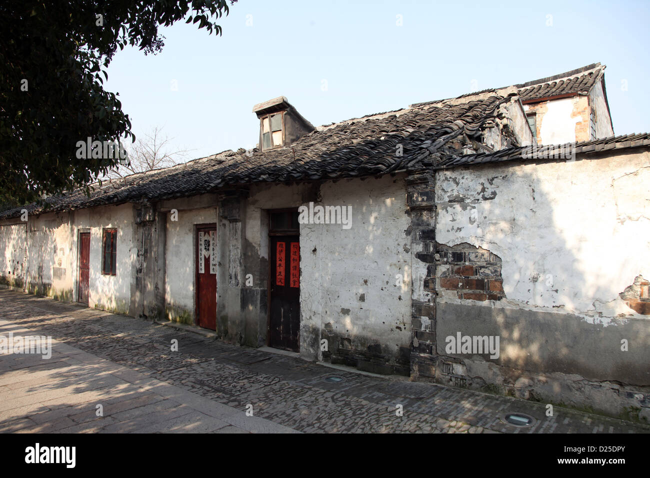 It's a photo of few old houses along a street in a Chinese city in ...
