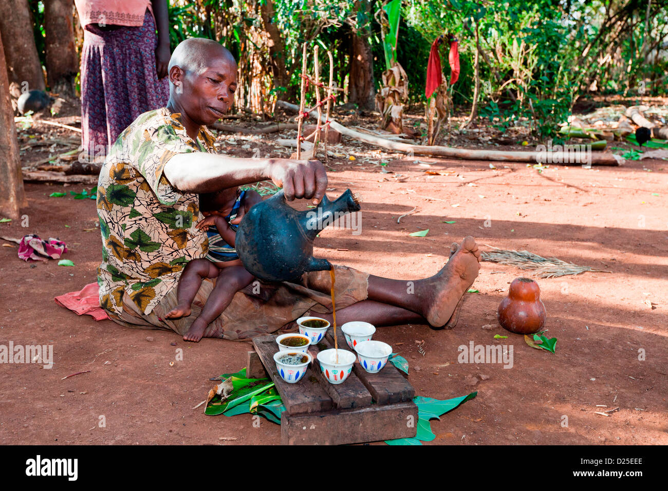 An Ari tribeswoman performs a traditional Ethiopian coffee ceremony at ...