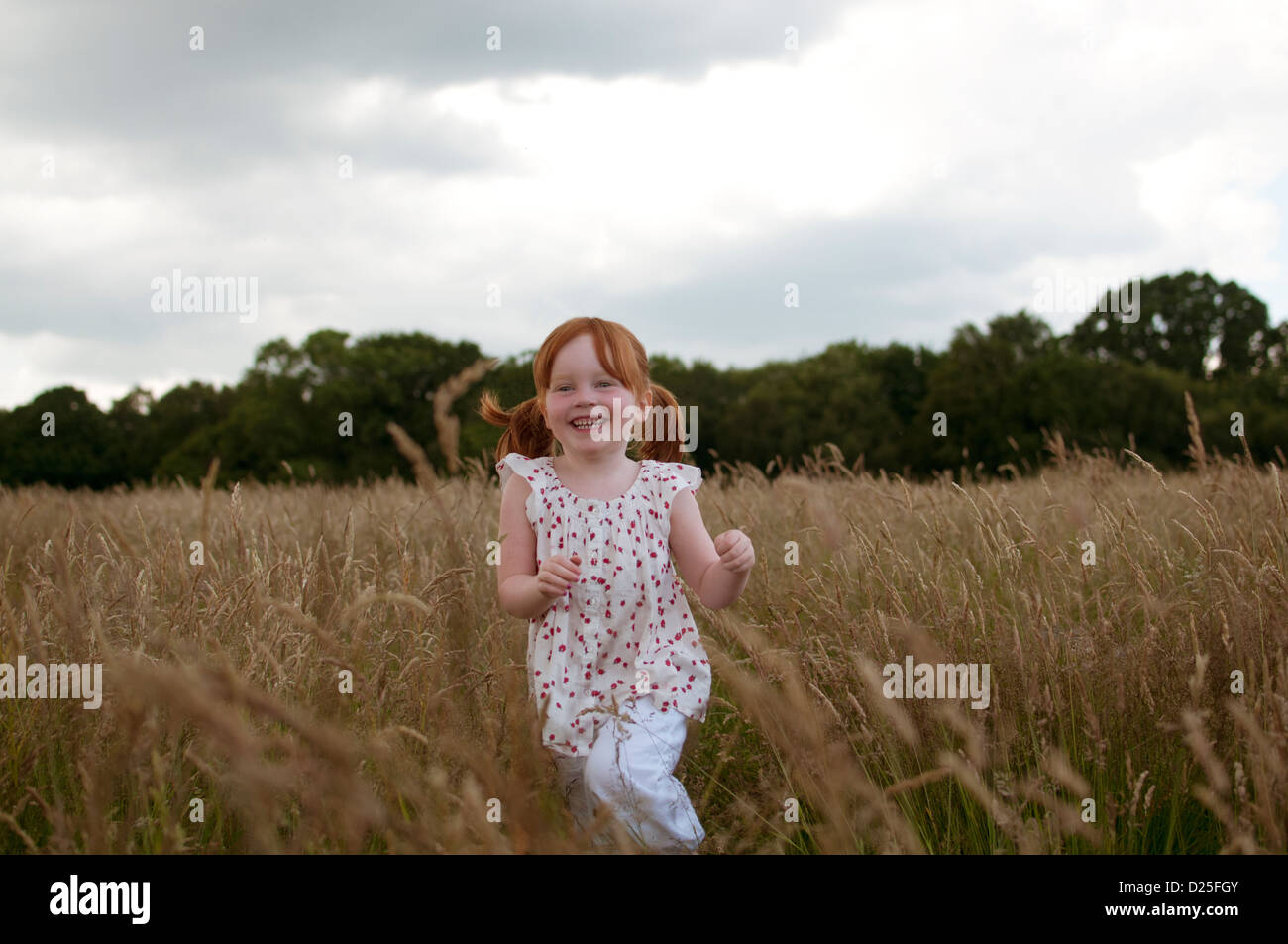 Little Girl Running In Field