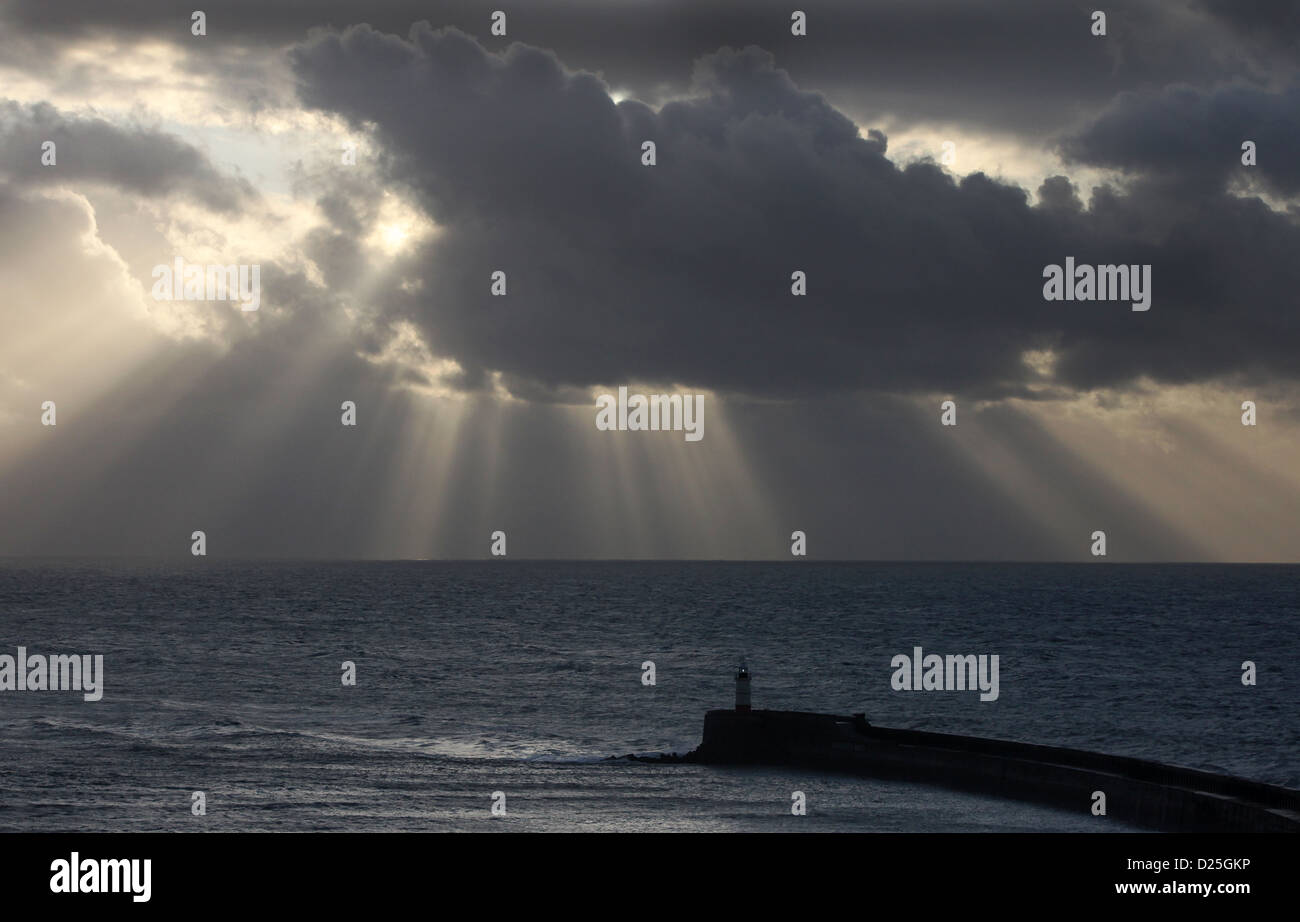 Rays of Sunlight filter through dark rain clouds over Newhaven ...