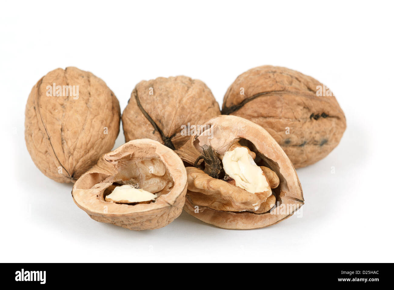 walnut and a cracked walnut isolated on the white background Stock ...