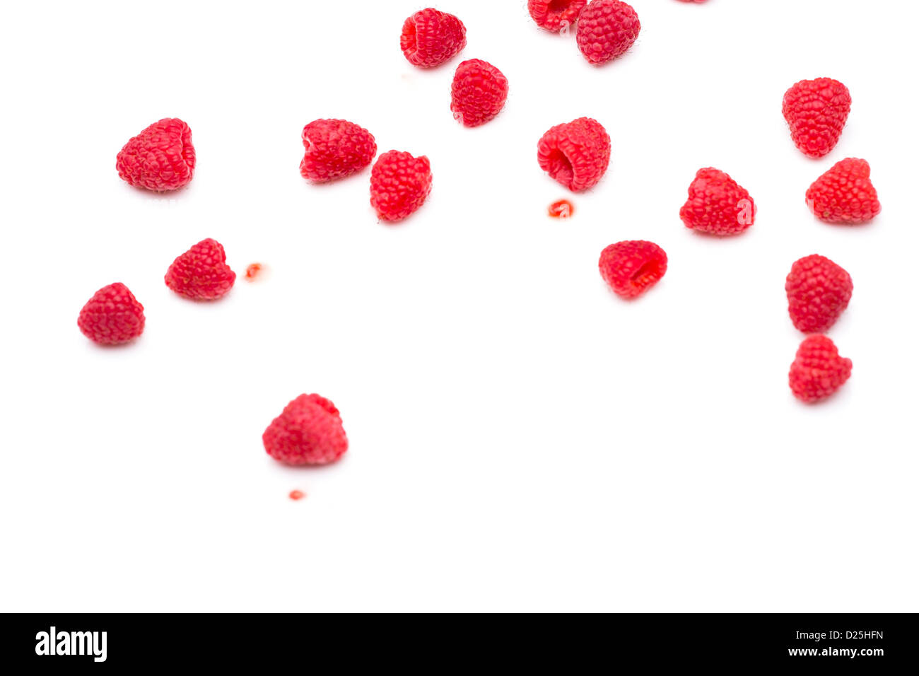 Close-up fresh raspberries white background Stock Photo - Alamy