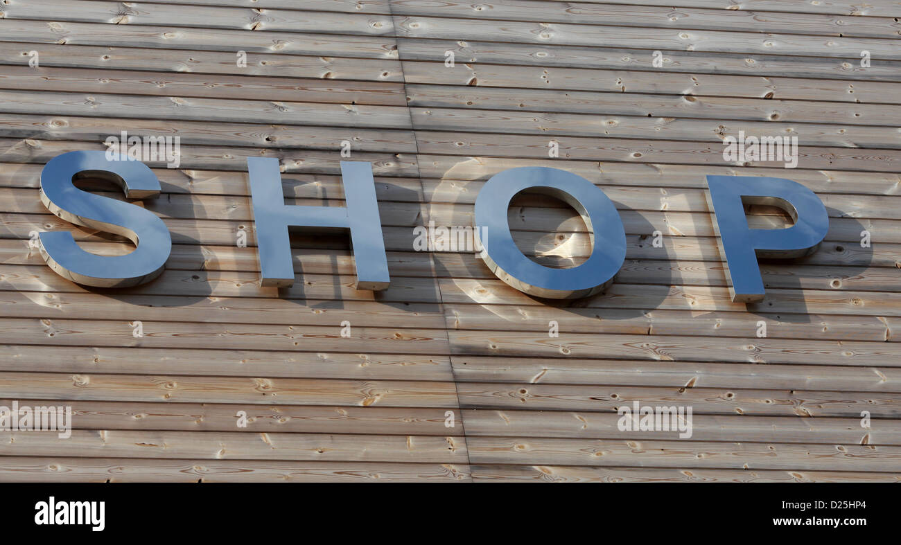 Shop Sign on timber wall Stock Photo - Alamy