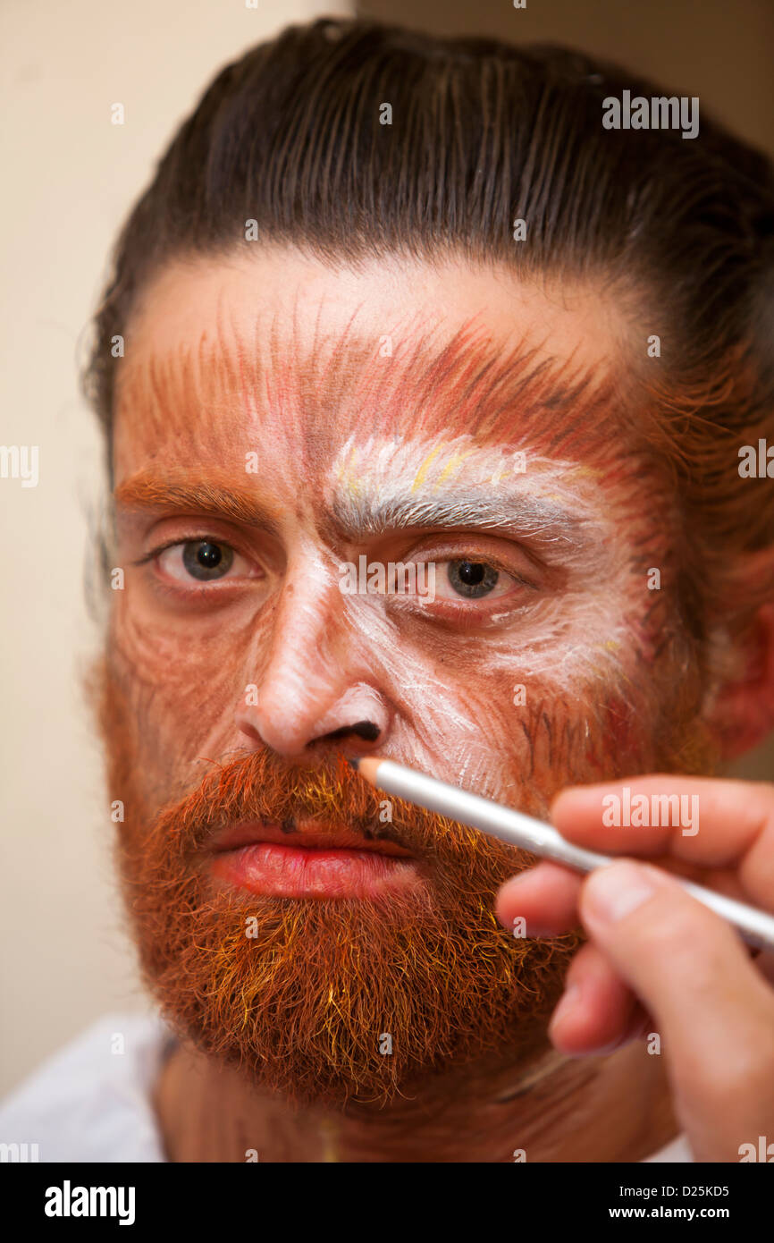 Man being painted on his face Stock Photo - Alamy