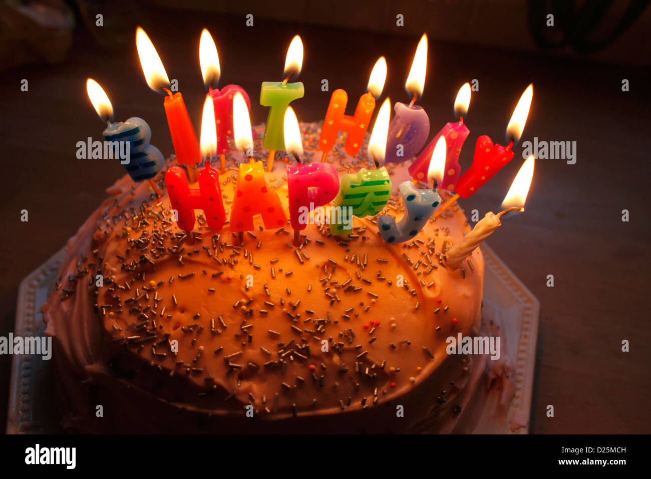 Birthday cake with flaming candles hi-res stock photography and images ...