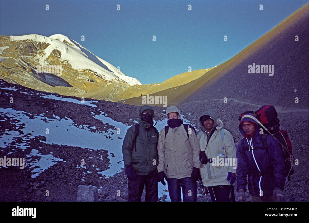 Trekkers and porters at dawn start of climb from Thorong Phedi to ...