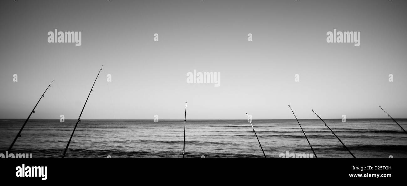 Fishing rods rest against railings on the pier at Saltburn Stock Photo ...