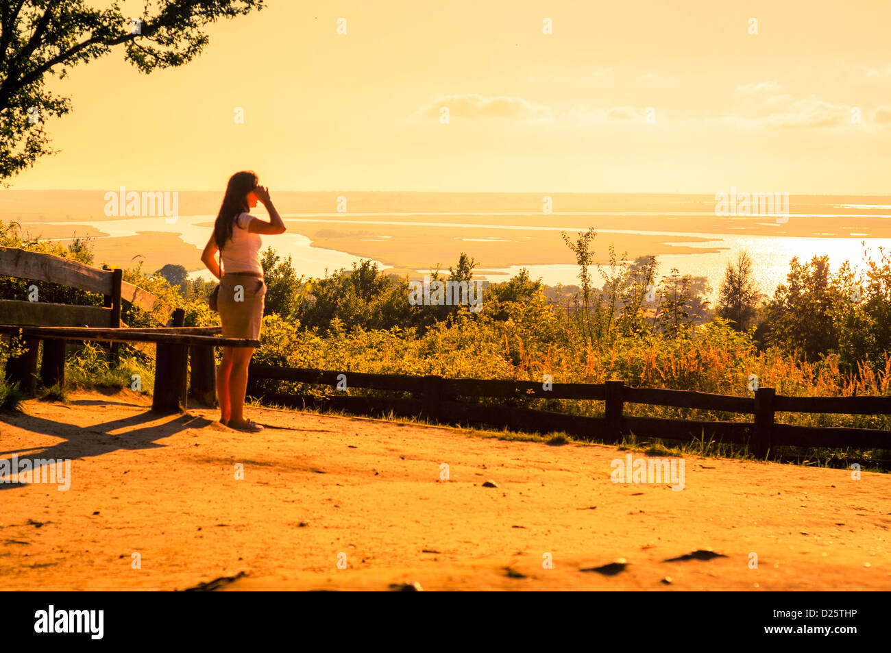 An image of women looking forward during sunset Stock Photo - Alamy