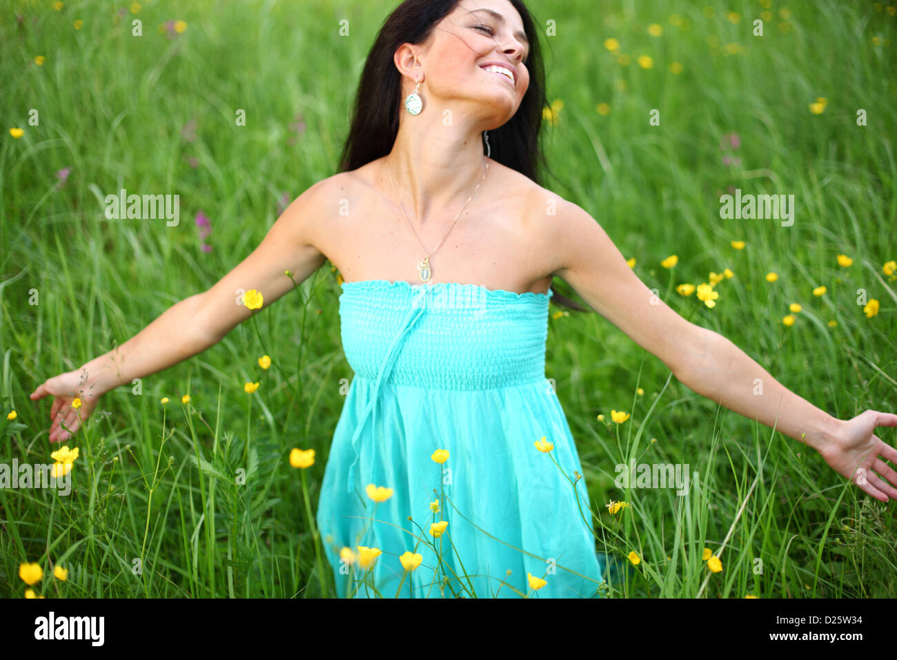 beautiful woman on flower field Stock Photo - Alamy