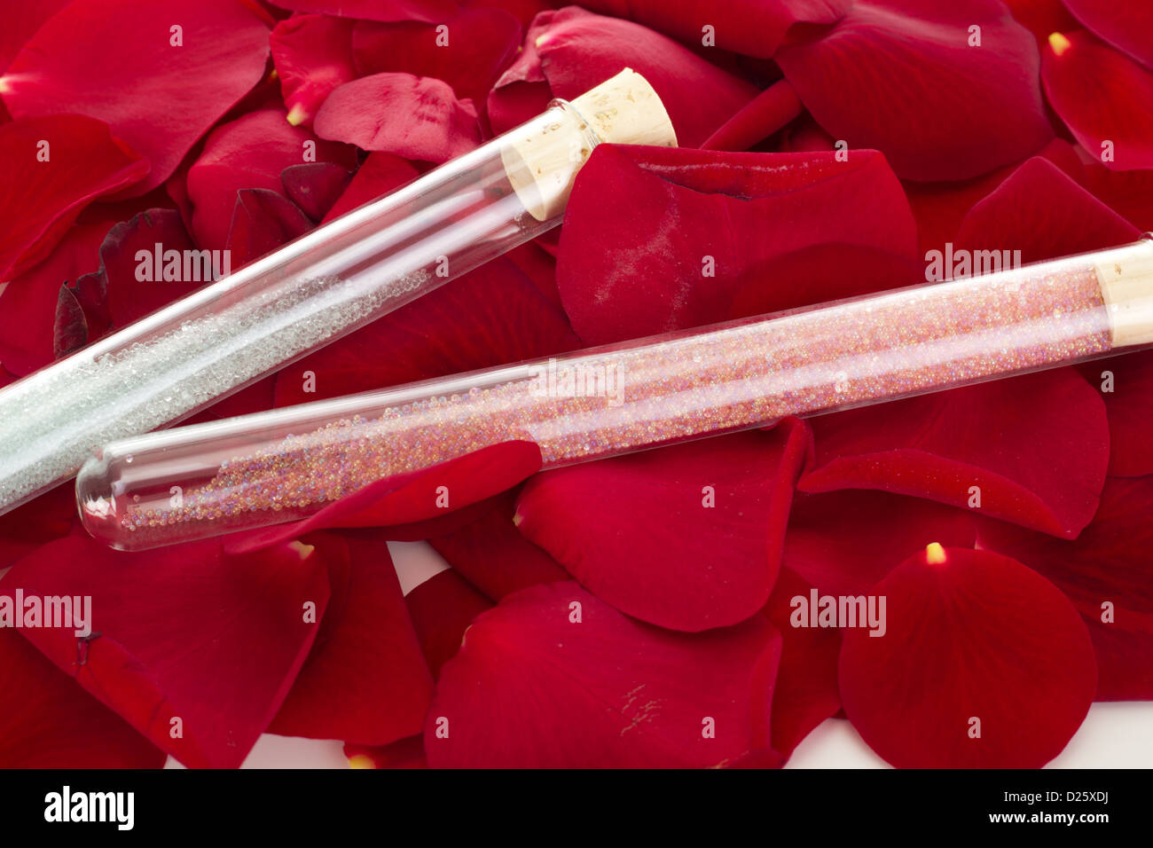 Rose petals with test tubes Stock Photo - Alamy