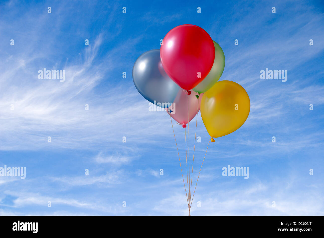 Balloons in a Blue Sky Stock Photo - Alamy