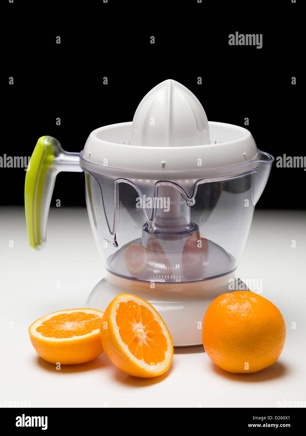 Orange juice squeezing machine Stock Photo - Alamy