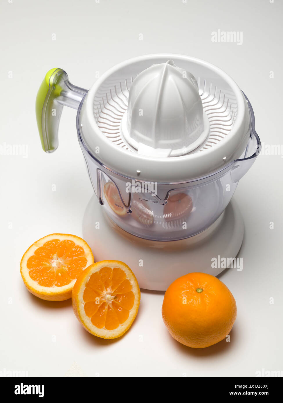 Orange juice squeezing machine Stock Photo - Alamy