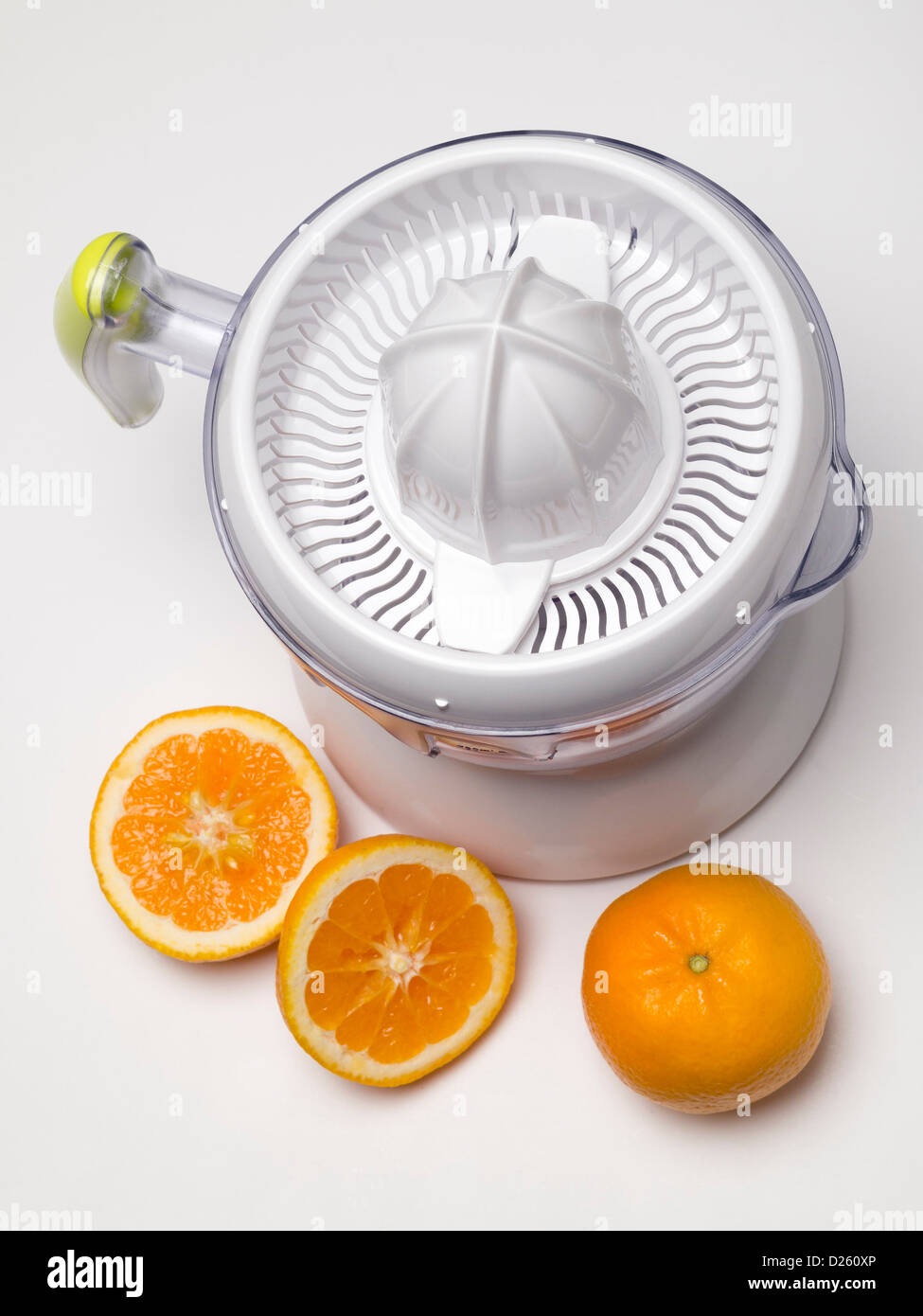 Orange juice squeezing machine from above Stock Photo - Alamy