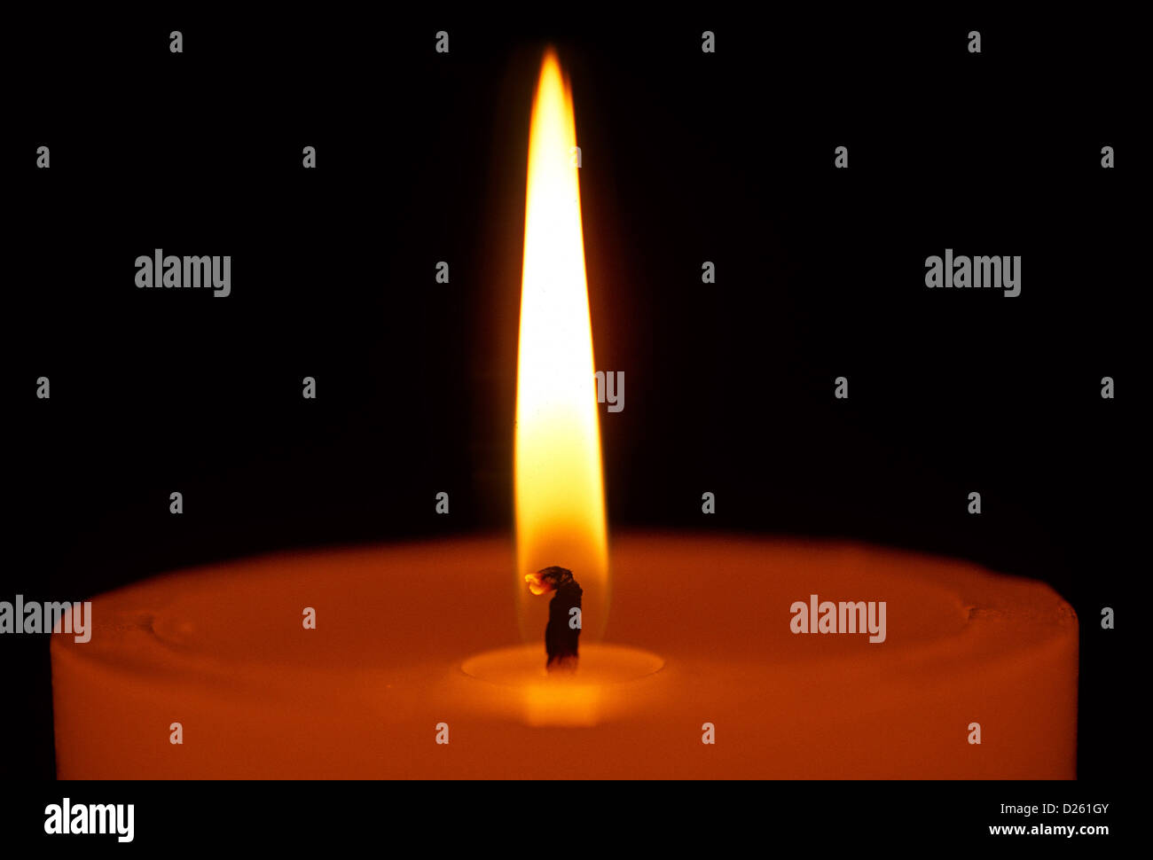 A single candle flame Stock Photo - Alamy