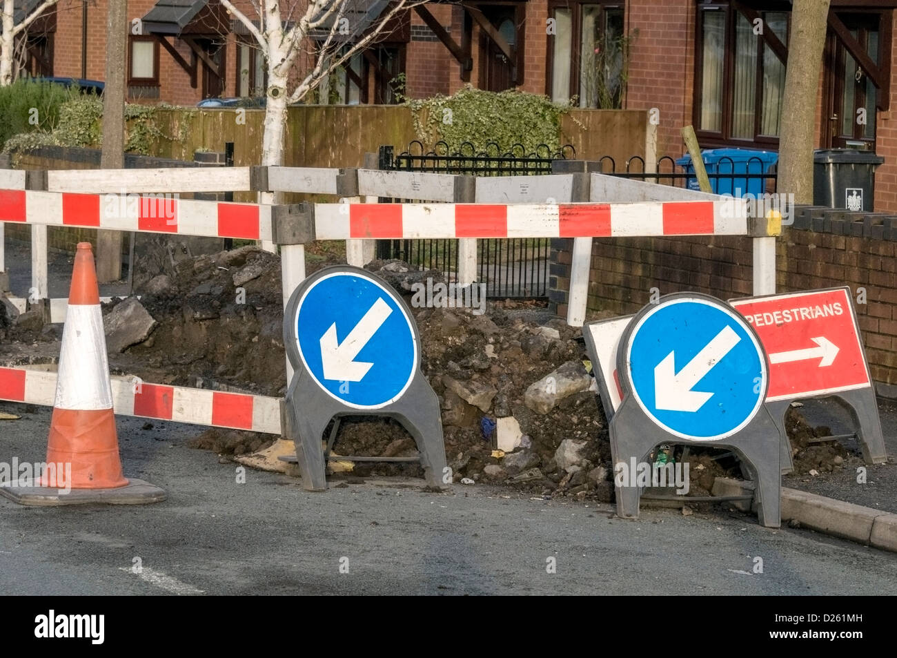 Rural roadworks with signs and temporary traffic lights control ...