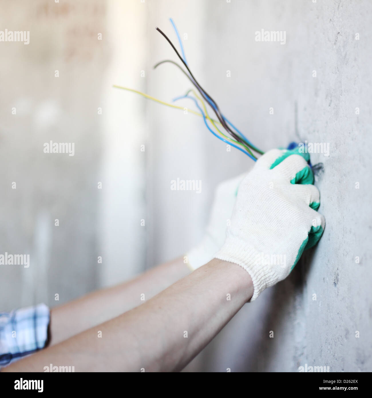 worker puts the wires in the wall Stock Photo - Alamy