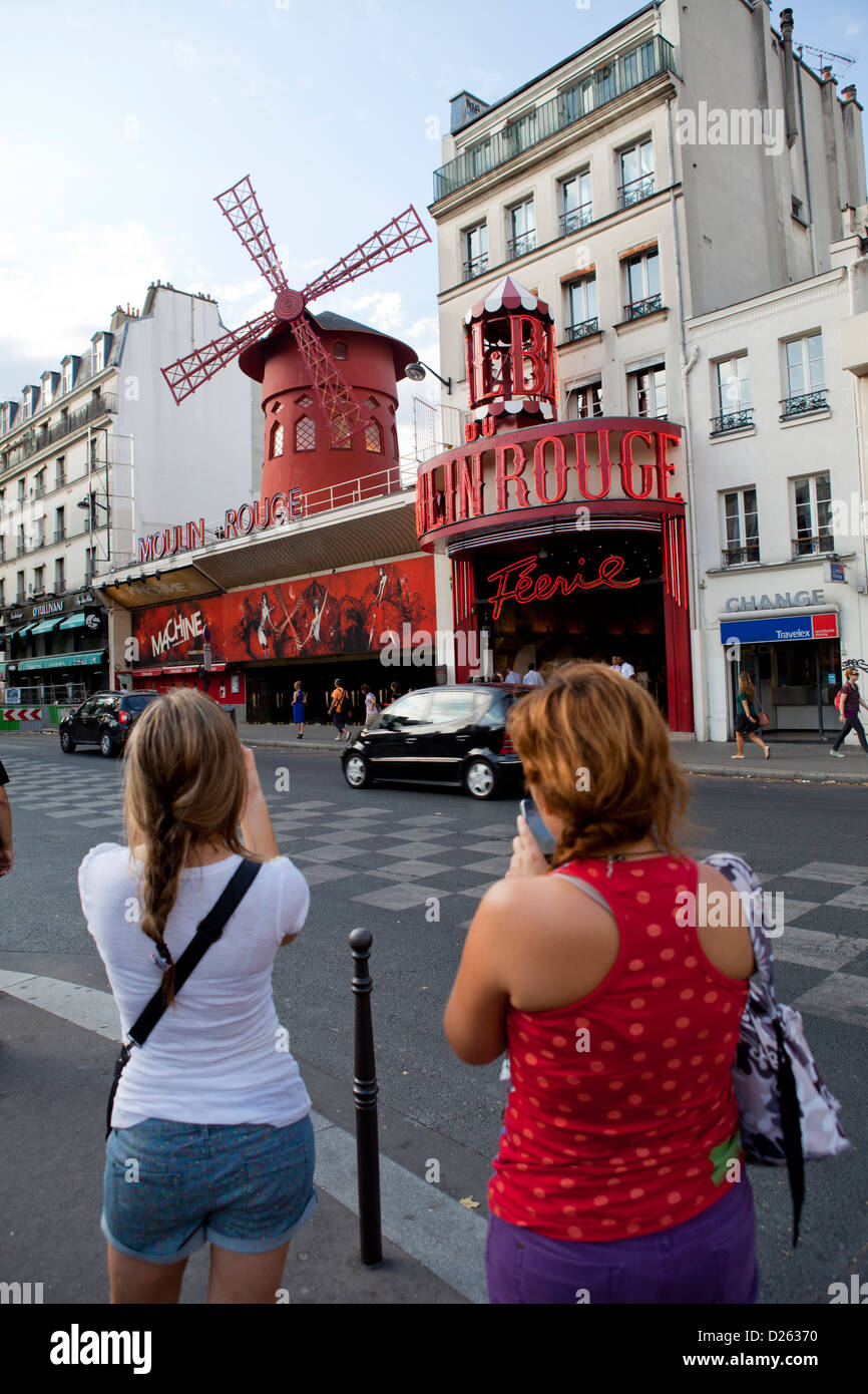 Women shooting at the Moulin Rouge famous Cabaret in Paris. Pigalle ...