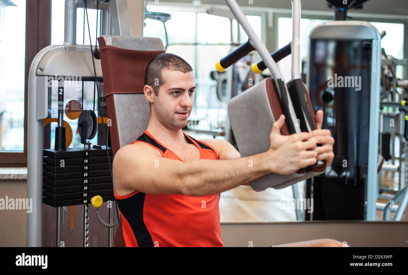 Man working out in a fitness club Stock Photo - Alamy